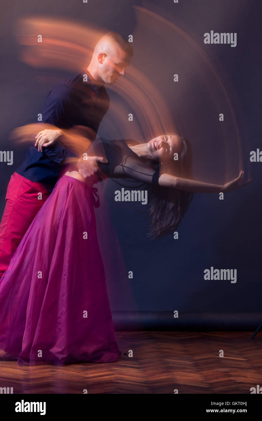Young dance couple man woman motion blur long exposure Stock Photo - Alamy