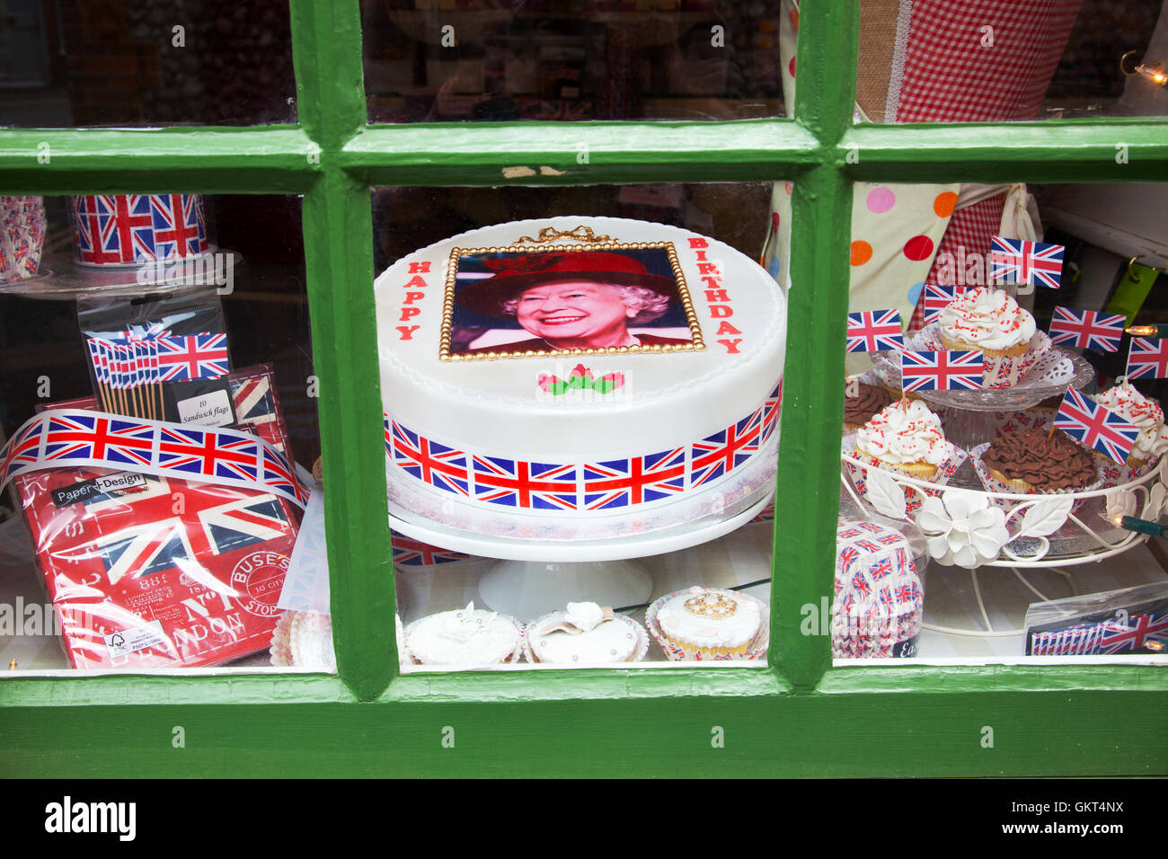 Cake shop window display with cake showing the Queen of England Stock ...