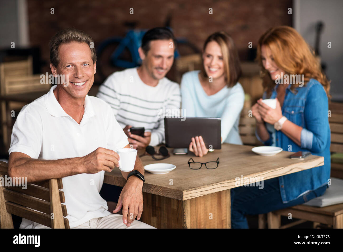 Nice people relaxing indoors Stock Photo - Alamy