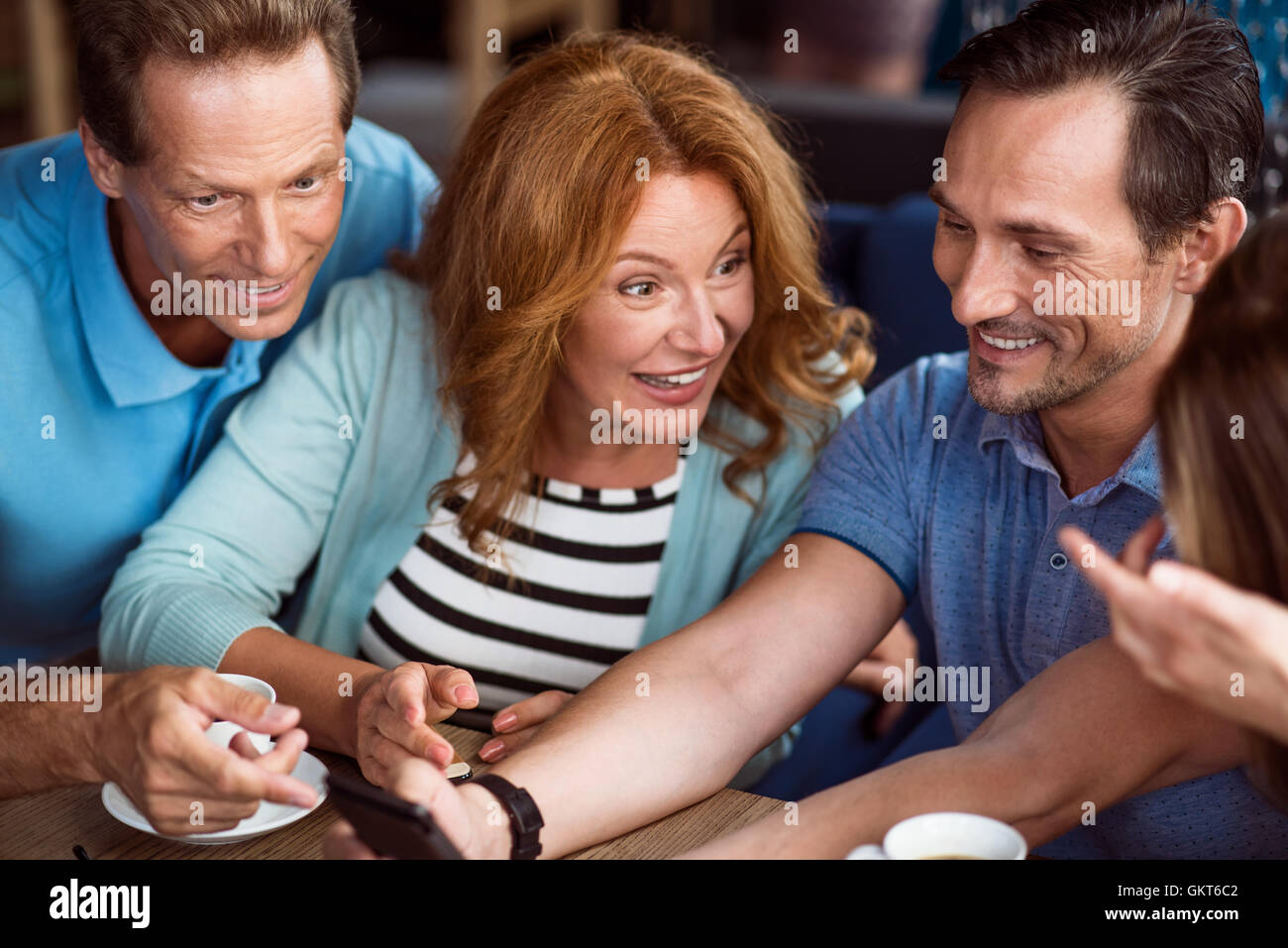 Group of people using smart phone Stock Photo - Alamy