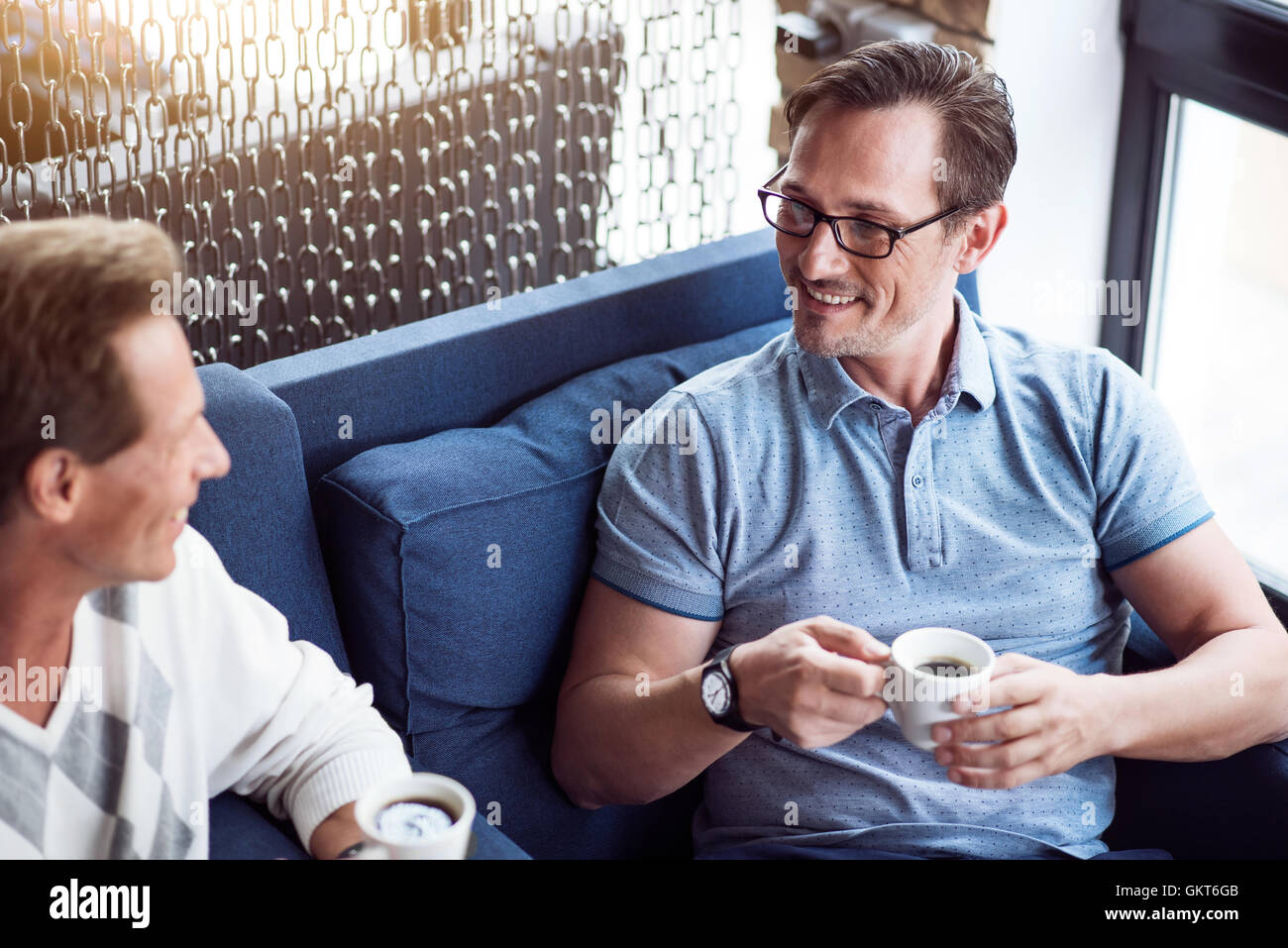 Two men drink coffee together hi-res stock photography and images - Alamy