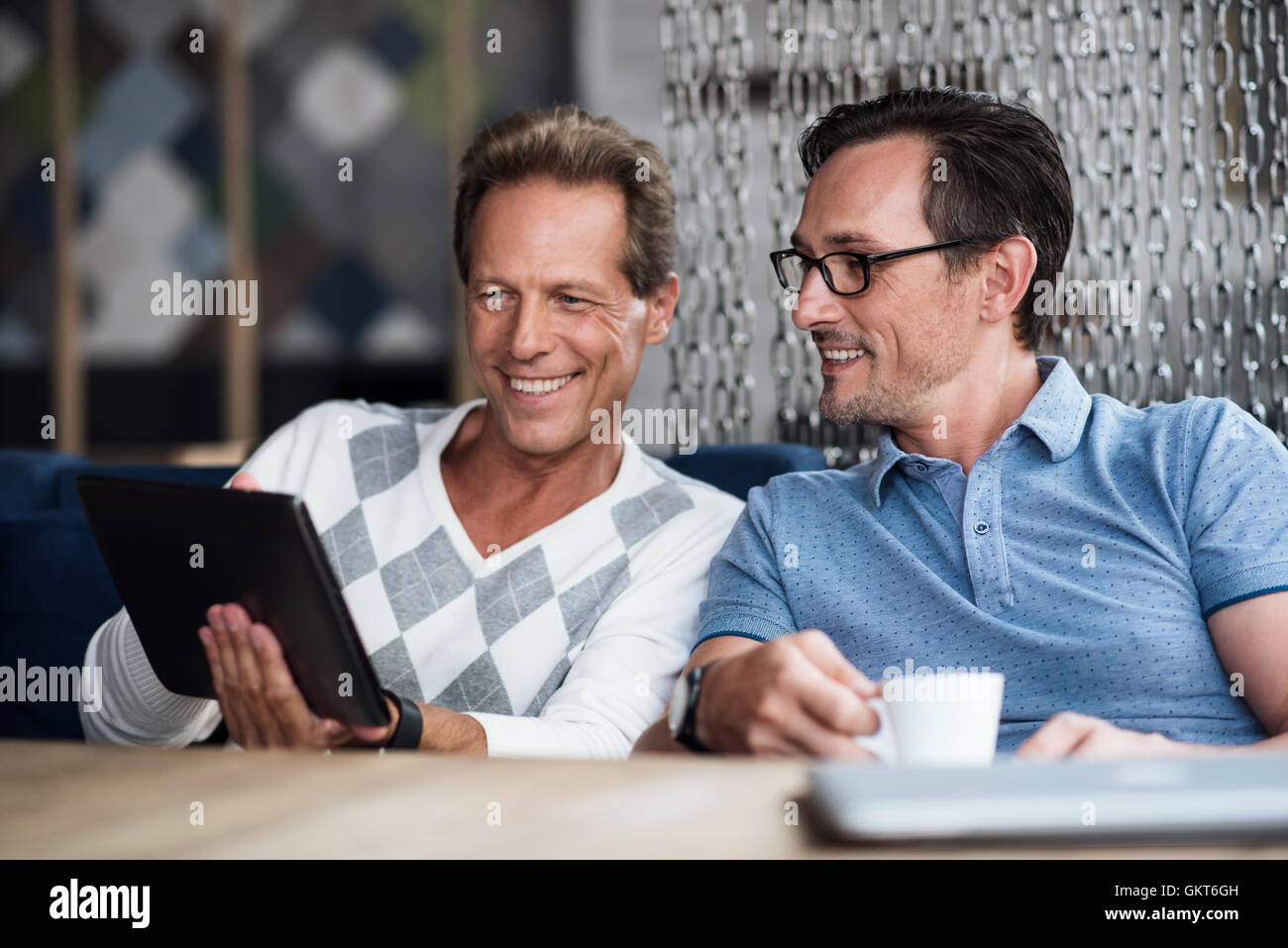 Two men working together Stock Photo - Alamy