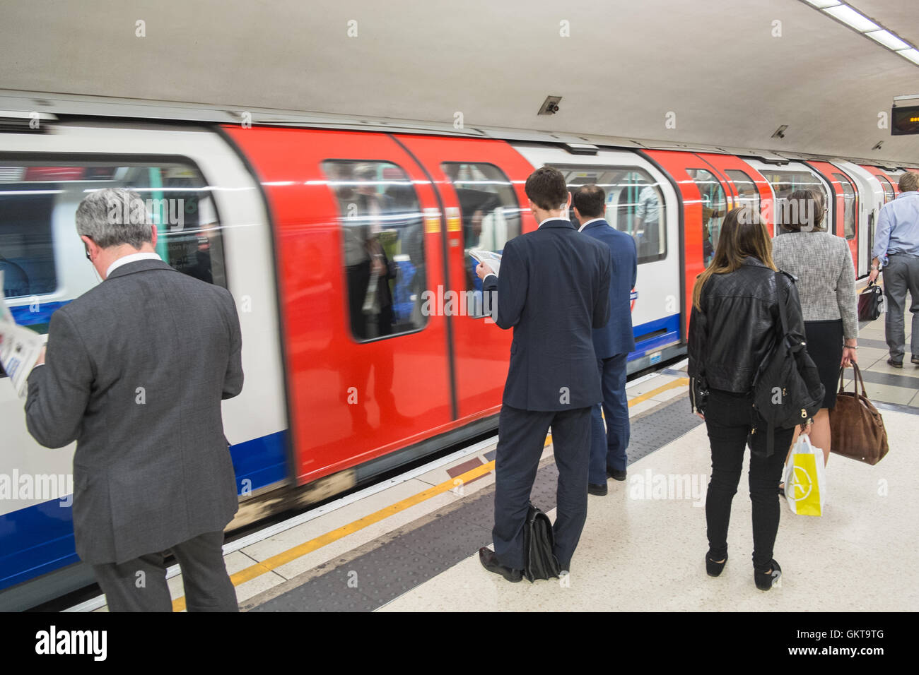 Commuters at Tube underground train station.London,U.K Stock Photo - Alamy
