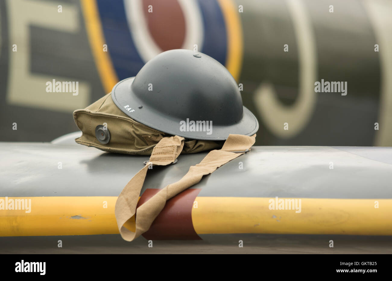 Tin helmet and bag on the wing of a Spitfire Stock Photo - Alamy