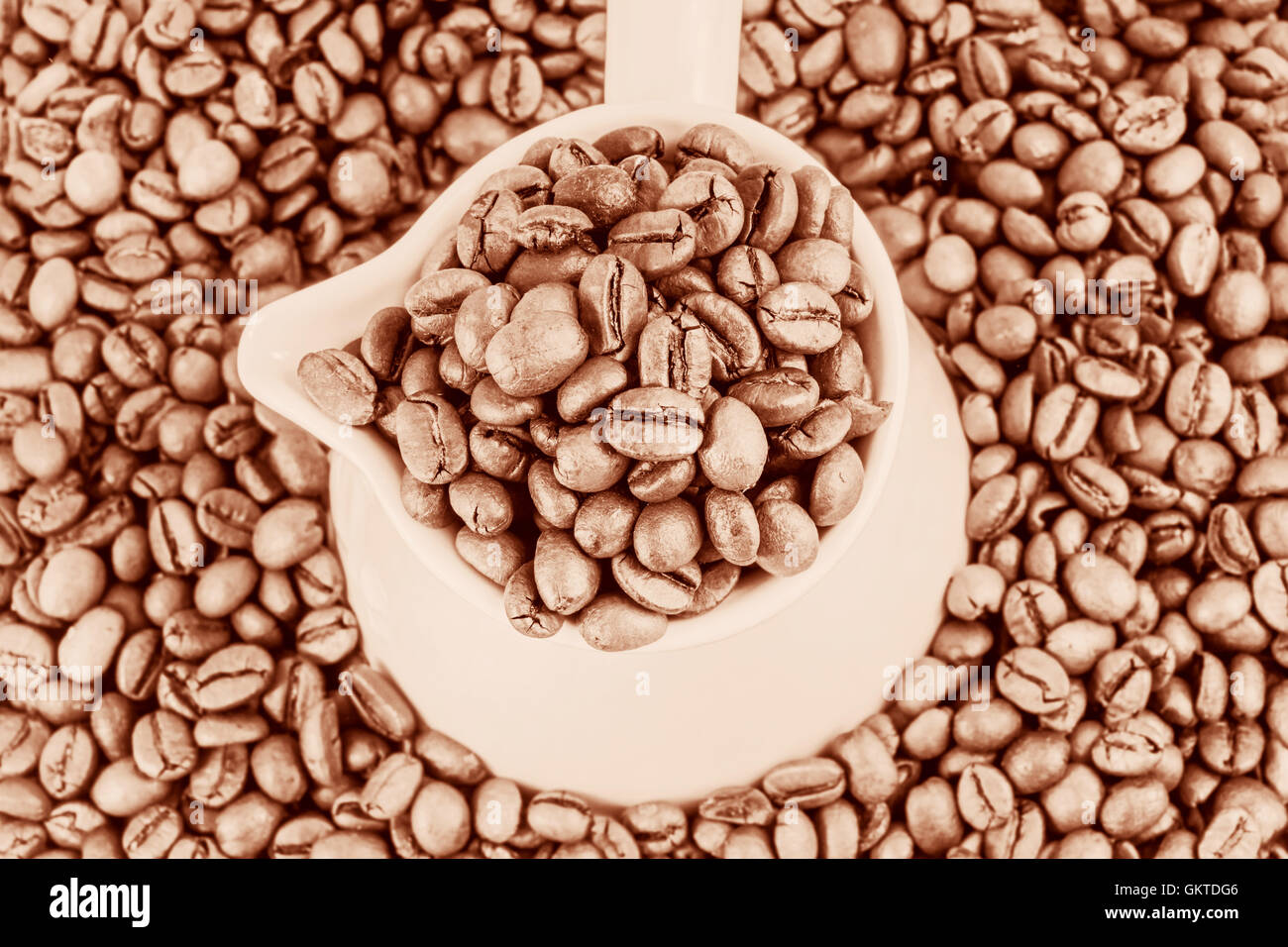 Big coffee beans and porcelaine white turk in sepia Stock Photo - Alamy