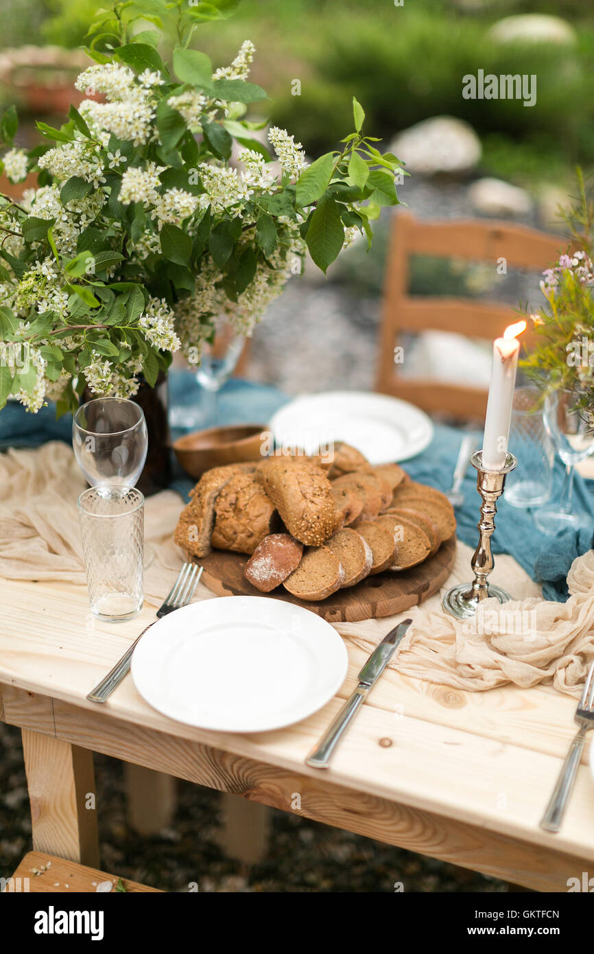 Festive decor. Bouquet from spring flowers. Table decor. Laying of food ...