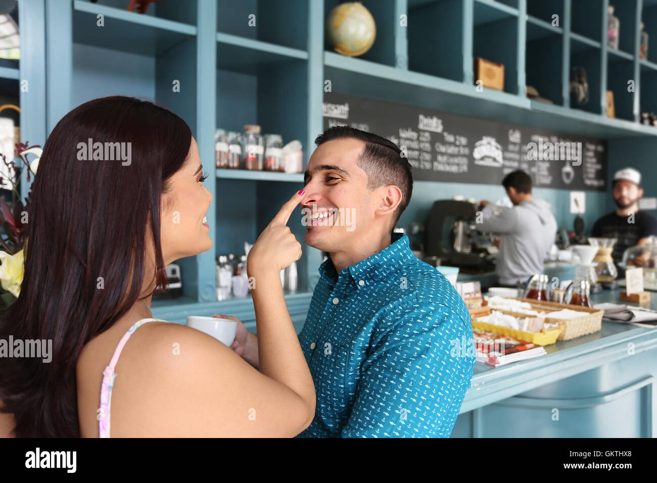 Cheerful loving couple having fun in cafeteria Stock Photo - Alamy