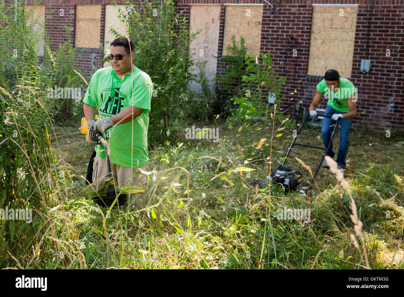 Detroit, Michigan - Volunteers clean up a distressed neighborhood ...