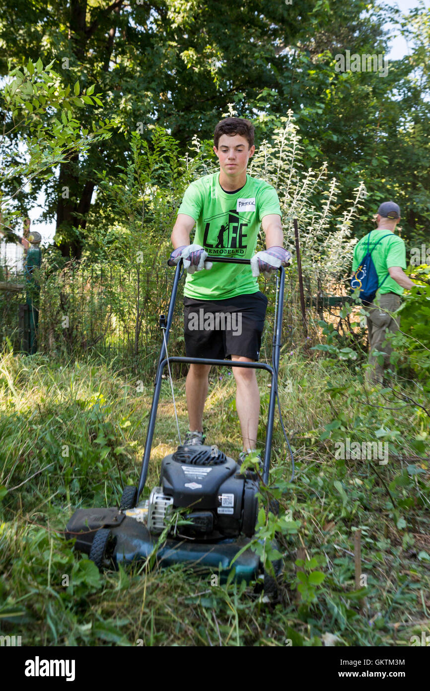 Detroit, Michigan - Volunteers clean up a distressed neighborhood ...