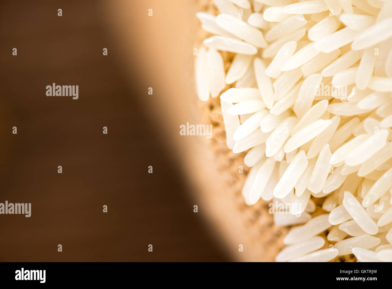 white rice in burlap sack Stock Photo - Alamy