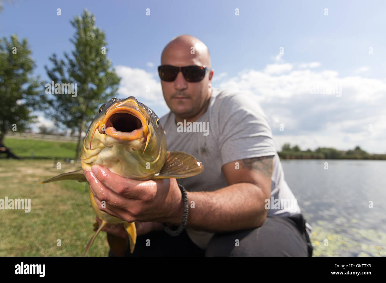 Angler with carp fishing trophy Carp and Fisherman, Carp fishing trophy ...