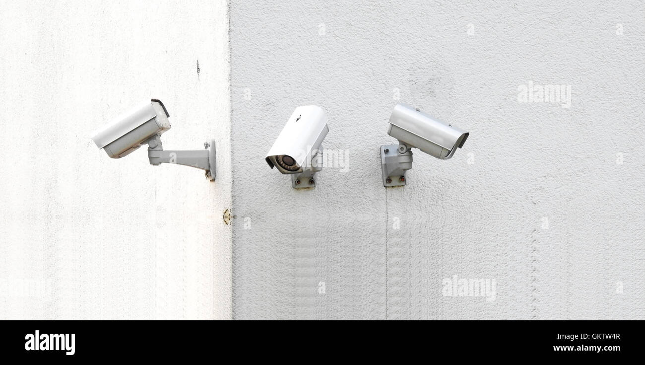 Three surveillance cameras Stock Photo - Alamy