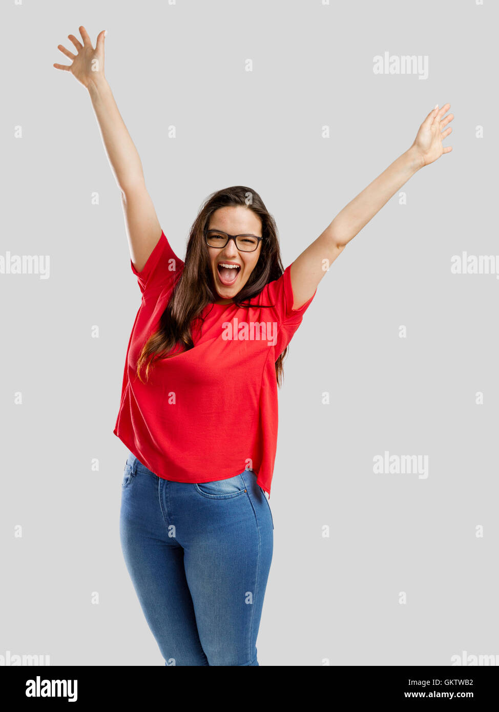 Happy woman with arms up, isolated over white background Stock Photo ...