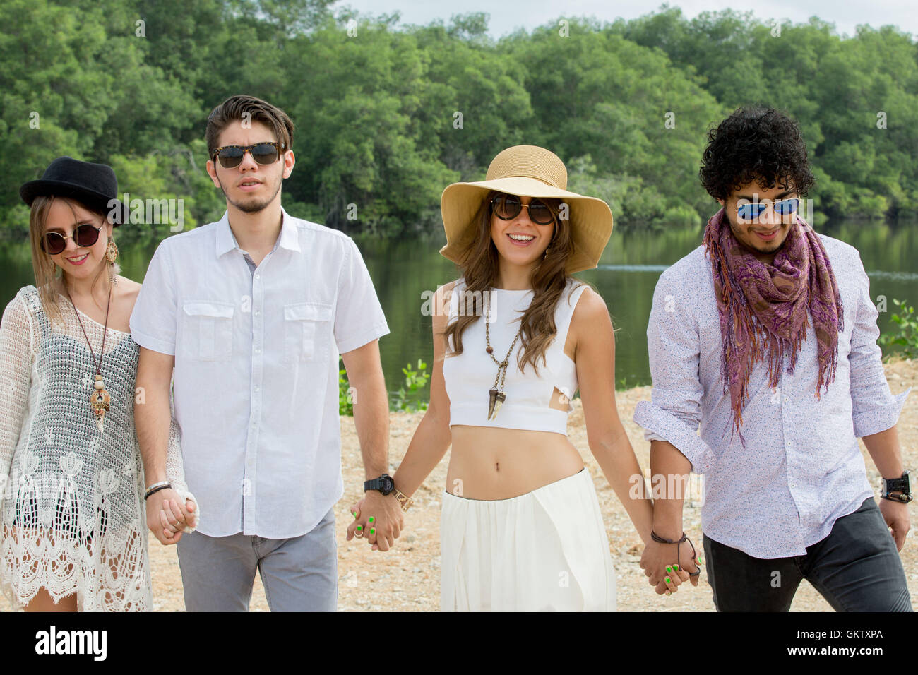 Four friends holding hands close up #3 Stock Photo - Alamy