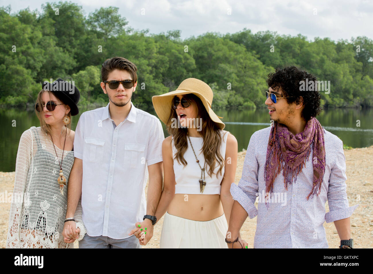 Four friends holding hands close up #1 Stock Photo - Alamy