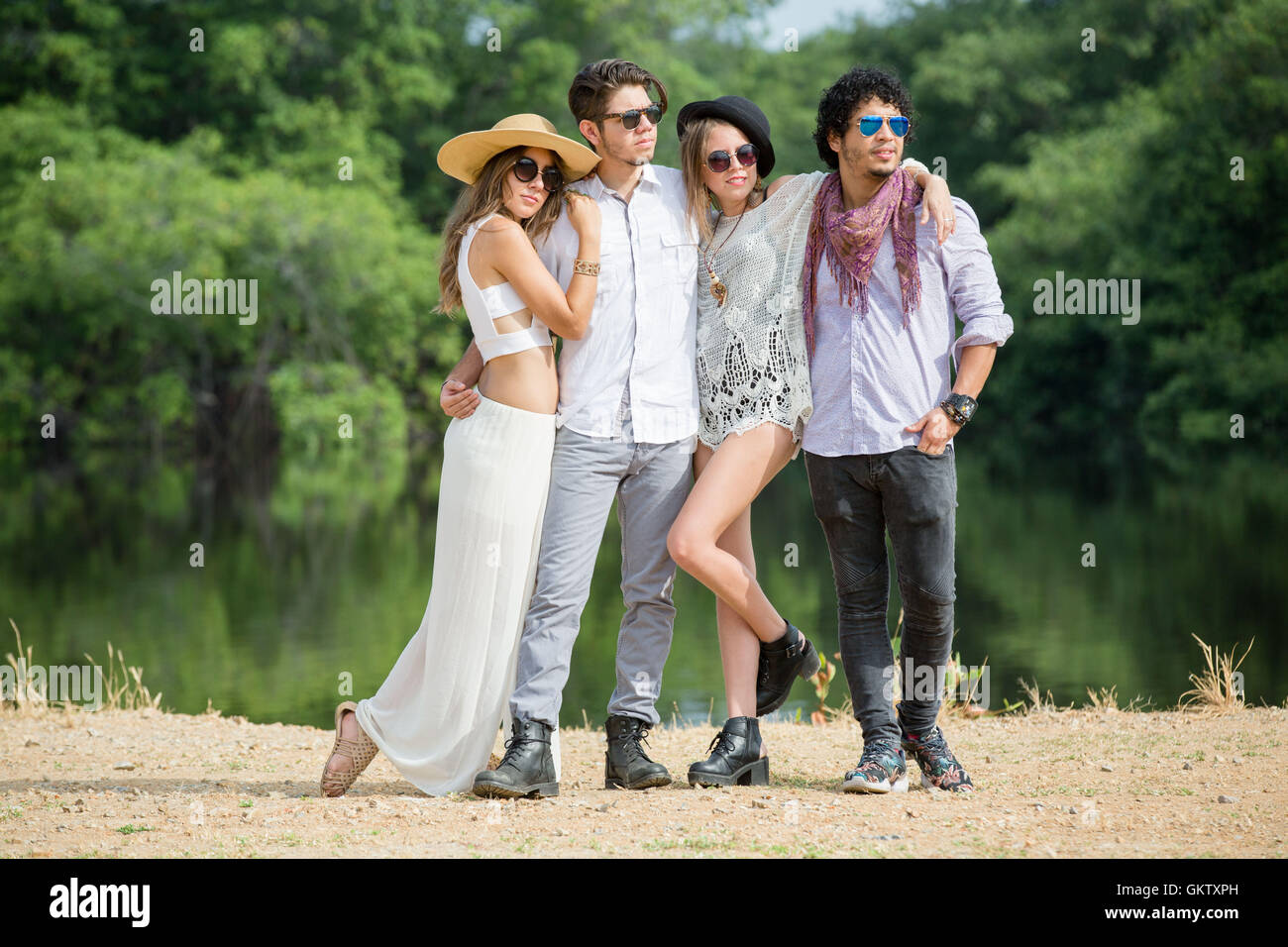 Friends hugging outdoors Stock Photo - Alamy