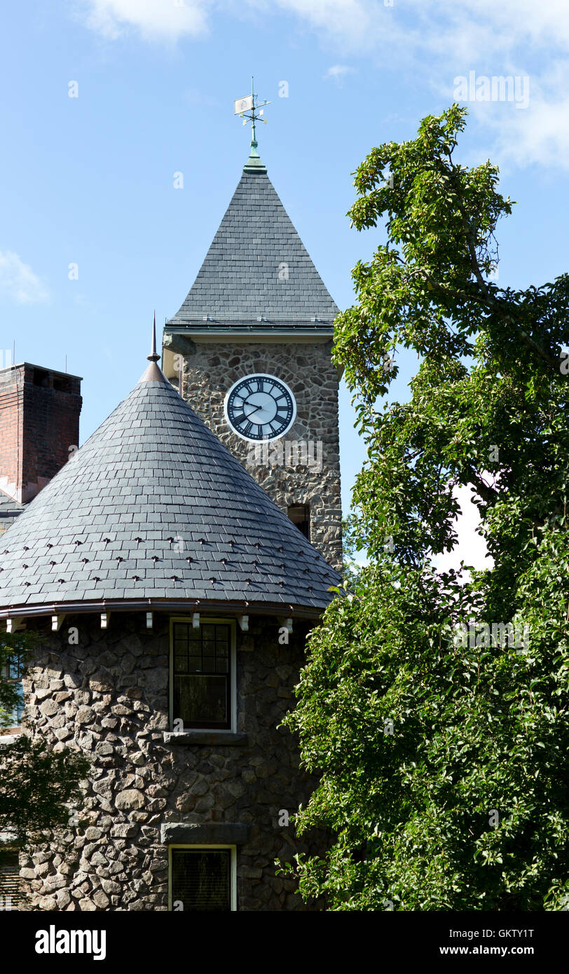 Stone clock tower with turret Stock Photo - Alamy