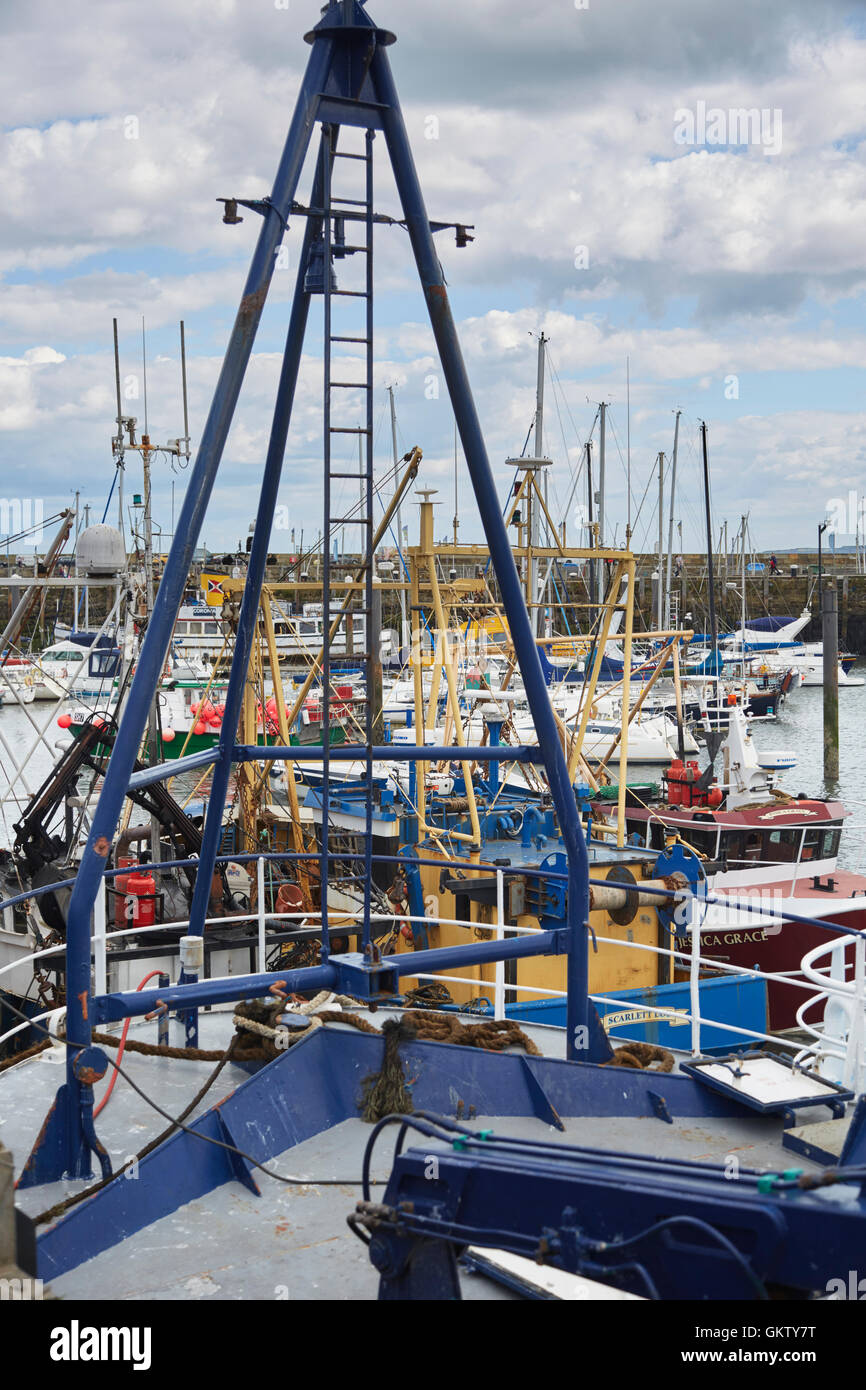 View across Scarborough harbour with many masts and superstructure of ...