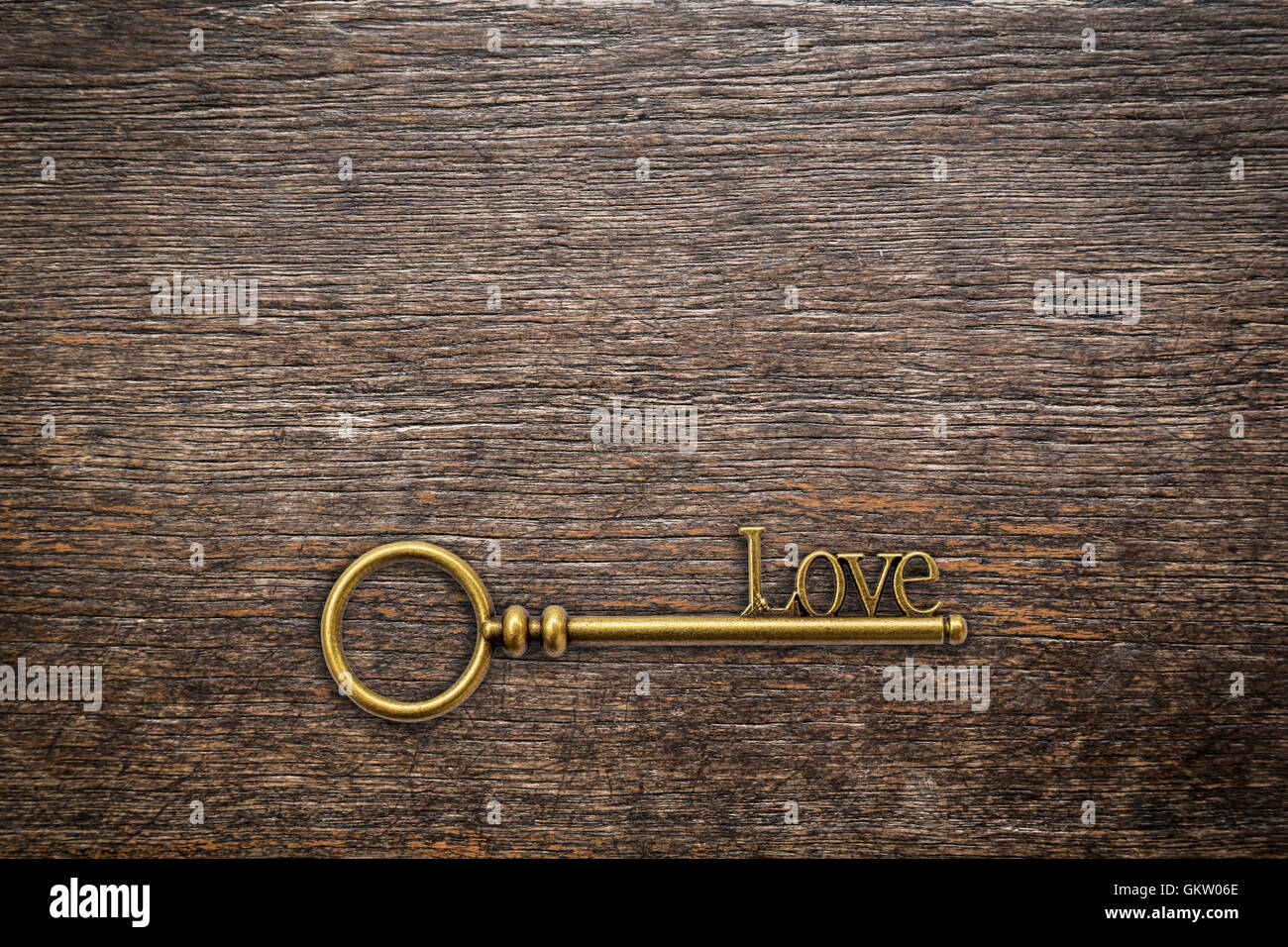 Vintage key for love on wood background with space. Valentine ...