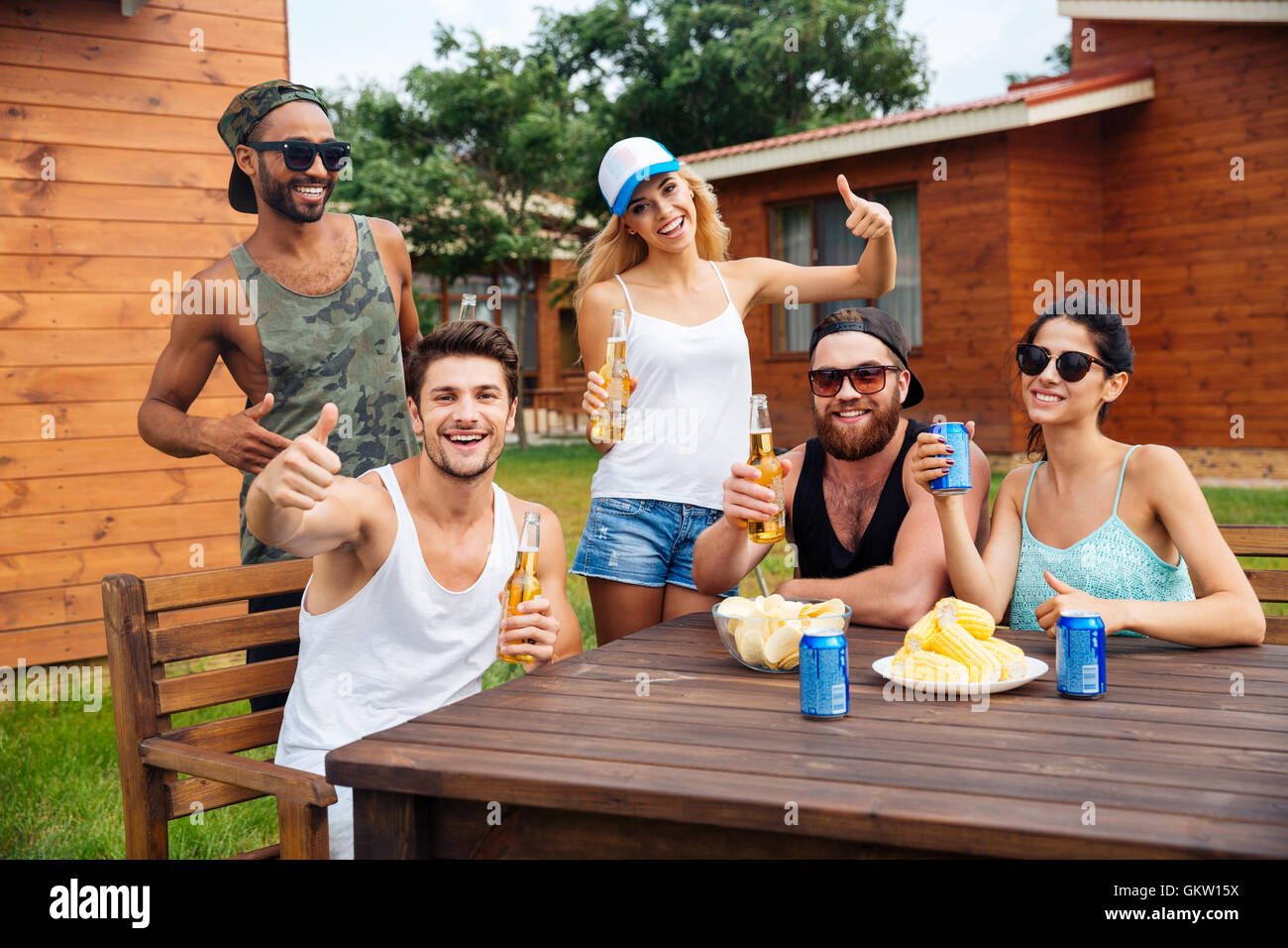 Young man woman holiday thumbs up hi-res stock photography and images ...