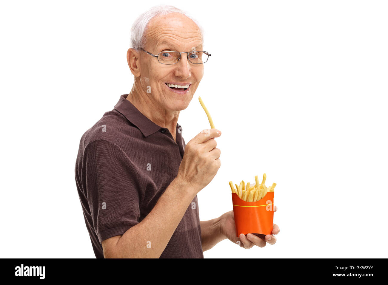 Happy senior man eating fries isolated on white background Stock Photo ...
