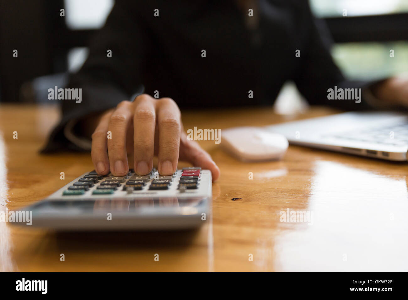 accountant working with calculator and computer laptop on office desk ...