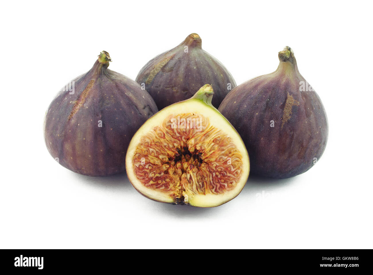 Three figs and half Stock Photo - Alamy