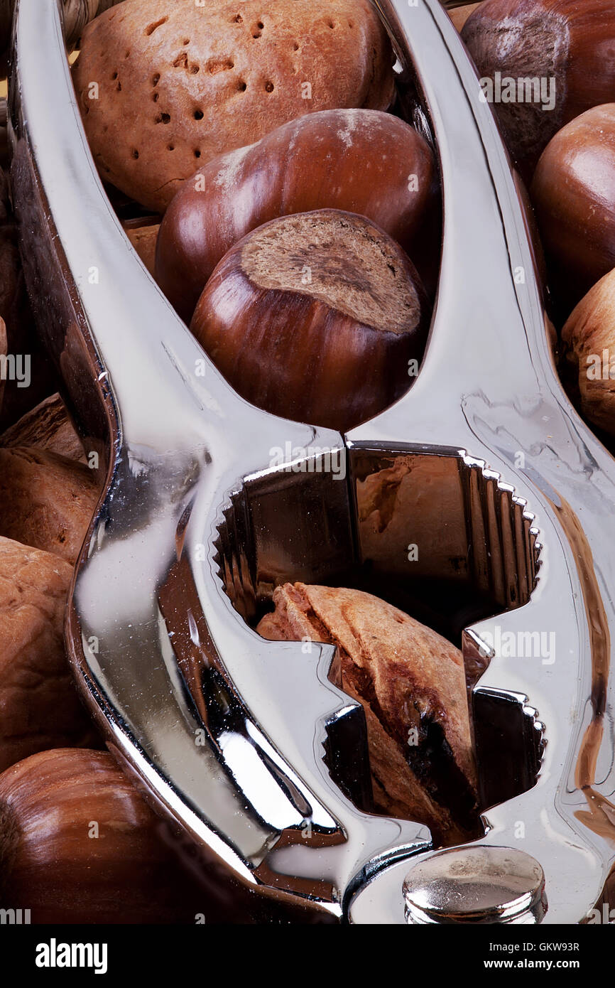 Nutcracker with nuts closeup Stock Photo - Alamy