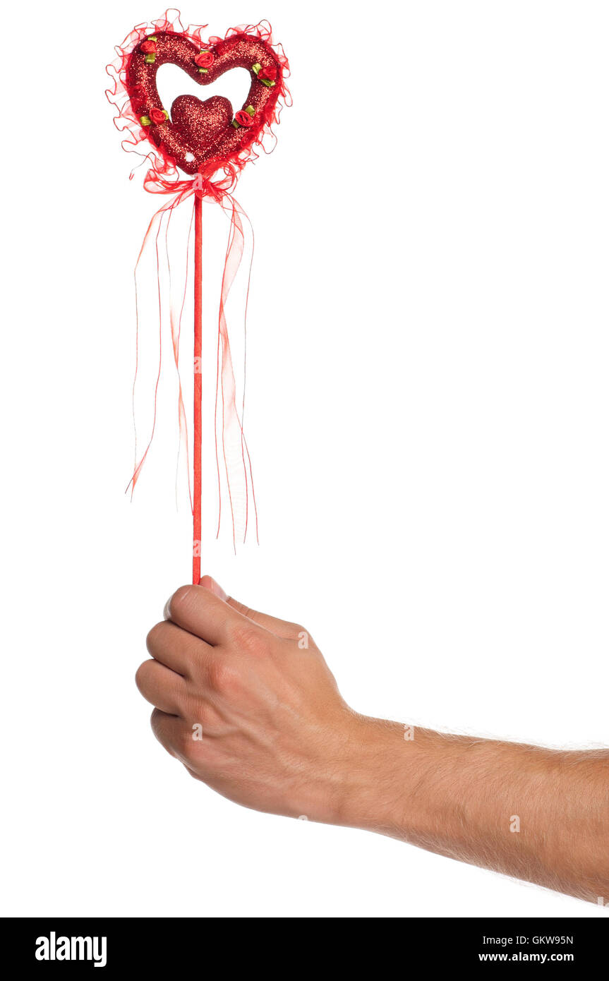Hand with heart on a stick Stock Photo - Alamy