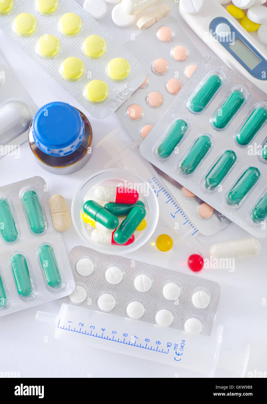 color pills and medical bottle Stock Photo - Alamy