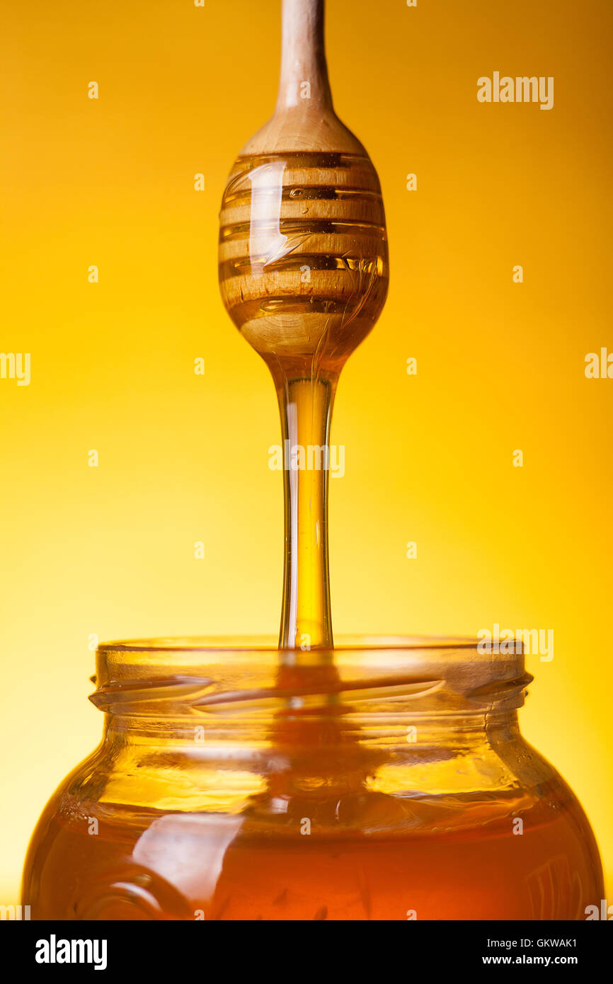 Golden honey dipper flowing hi-res stock photography and images - Alamy