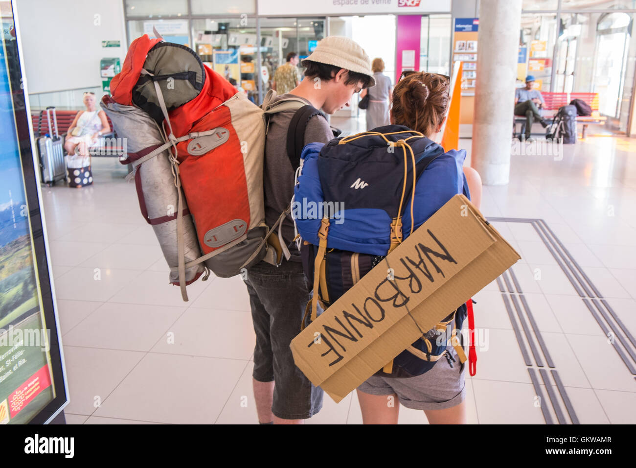 Hitchhiking coupleat Perpignan train station, Perpignan.Hoping to leave ...