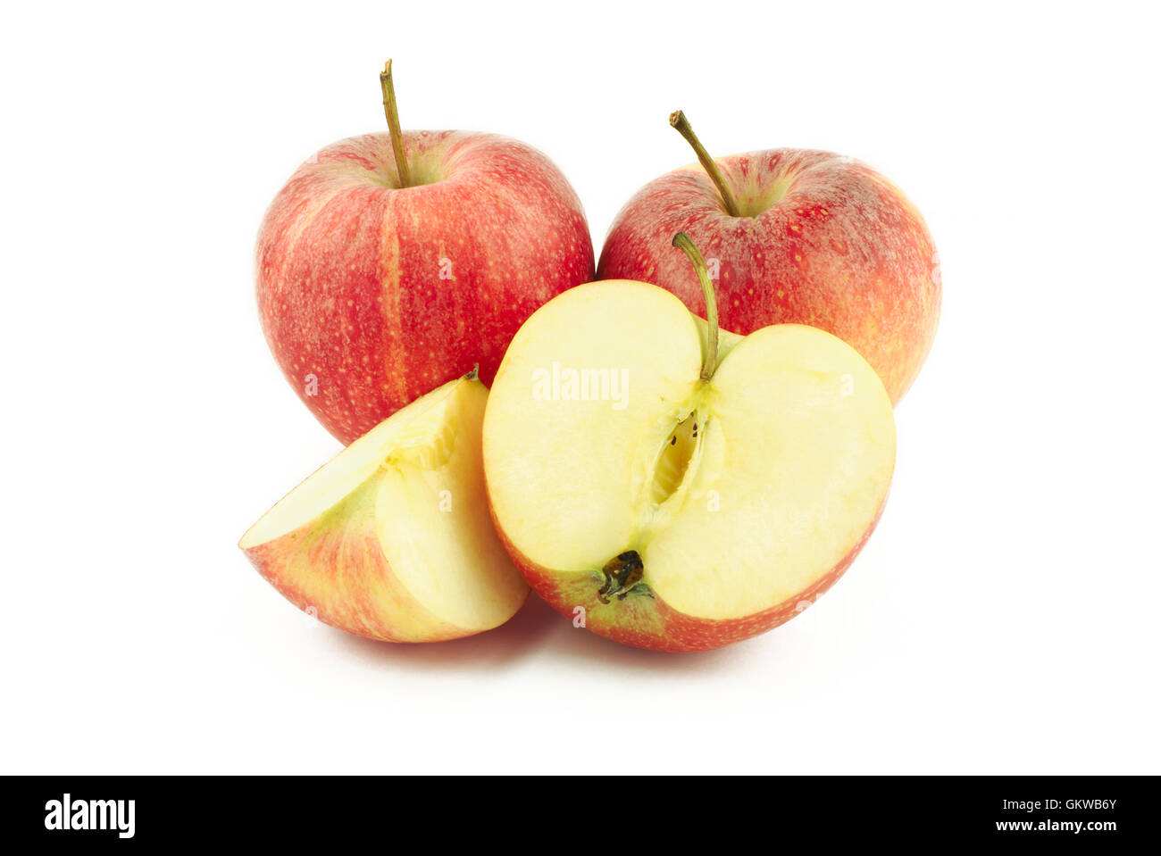 Two red apples, half and a slice Stock Photo - Alamy