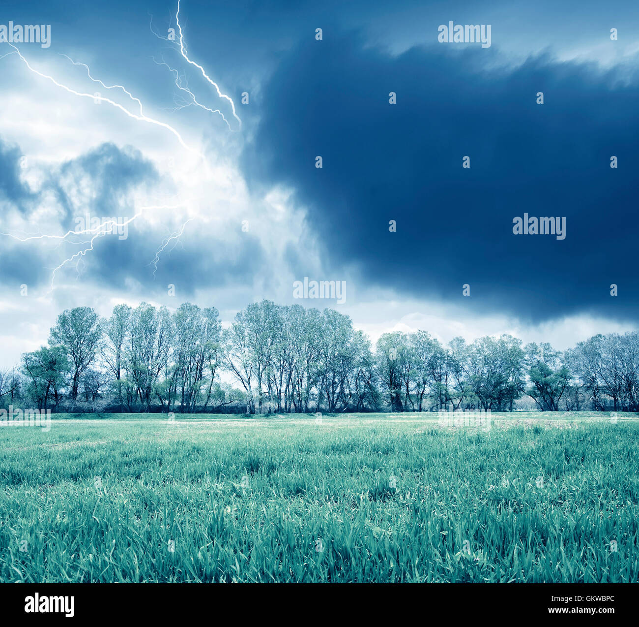 Green field and storm Stock Photo - Alamy