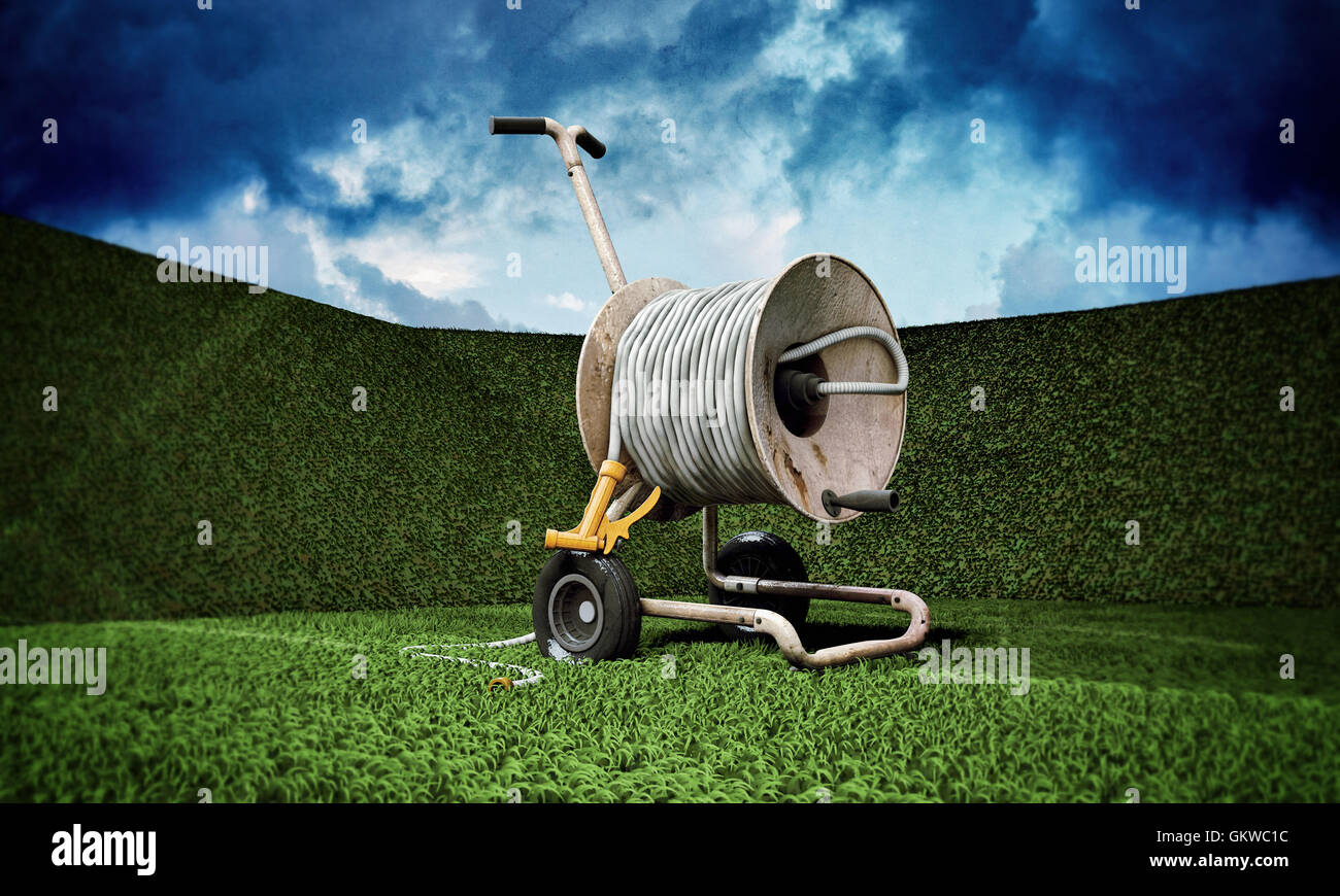 hose on green lawn Stock Photo - Alamy
