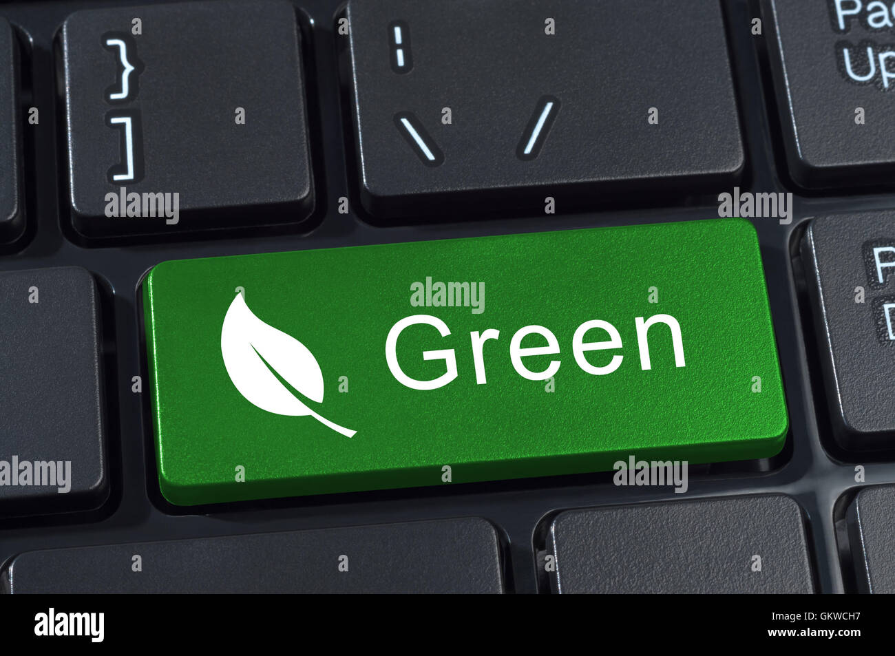 Green button keyboard with icon of leaf Stock Photo - Alamy