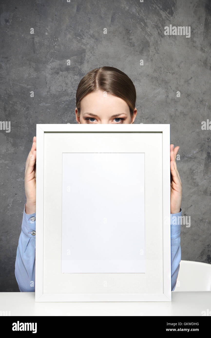 Girl with an empty frame Stock Photo - Alamy