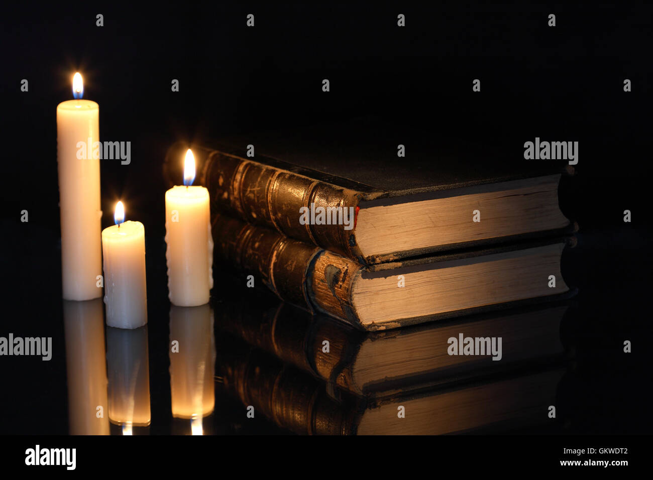 Books And Candles Stock Photo - Alamy