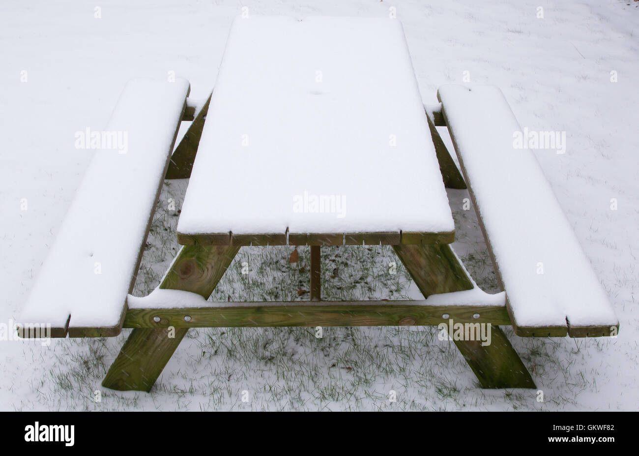 Picknick table covered in snow Stock Photo - Alamy