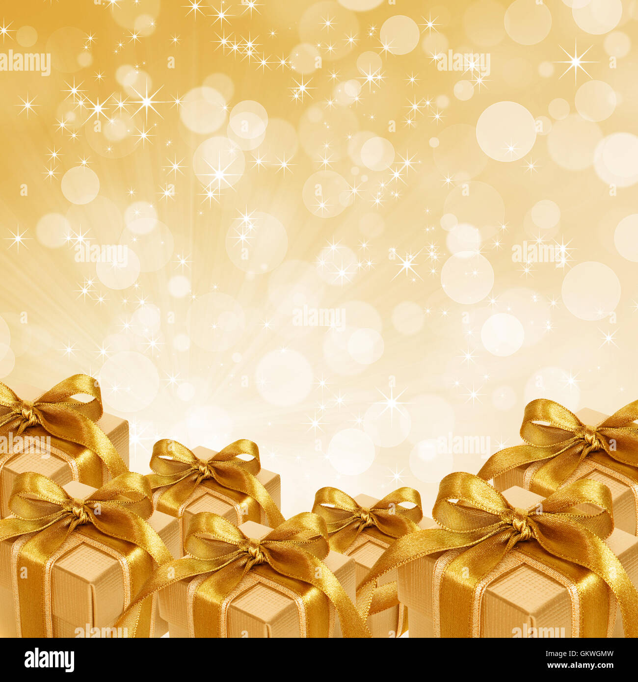gold gift box on abstract gold Christmas background Stock Photo - Alamy
