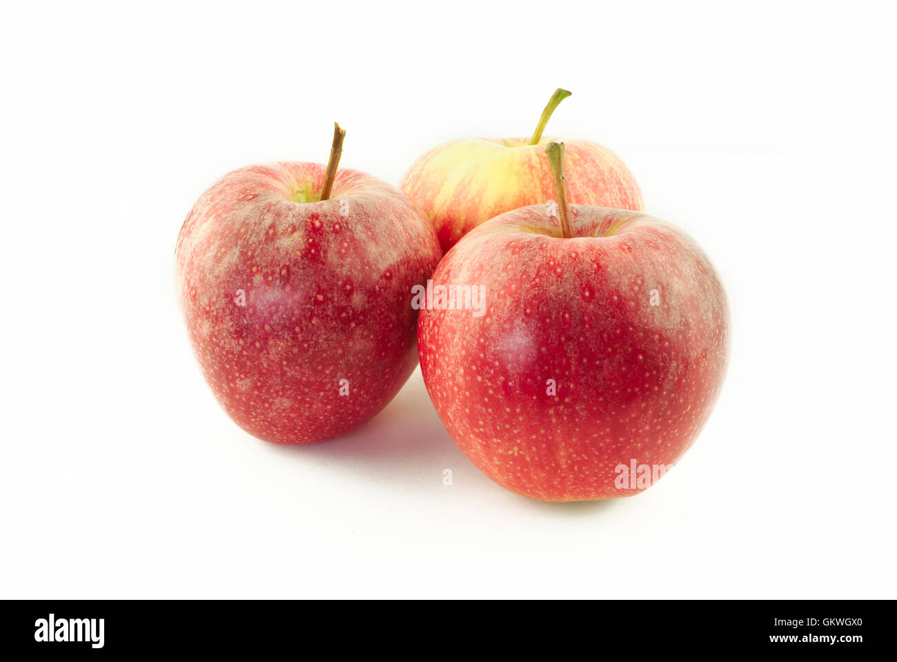 Three red apples Stock Photo - Alamy