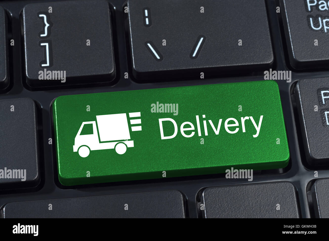 Keyboard button with truck icon and text delivery Stock Photo - Alamy