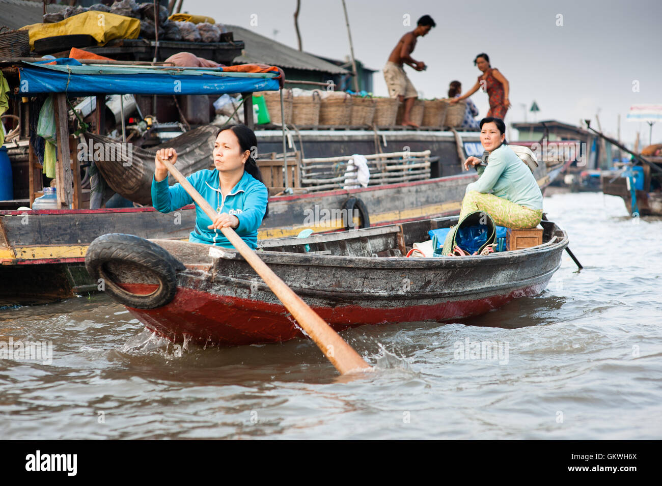 Women paddling boat on floating market Stock Photo - Alamy
