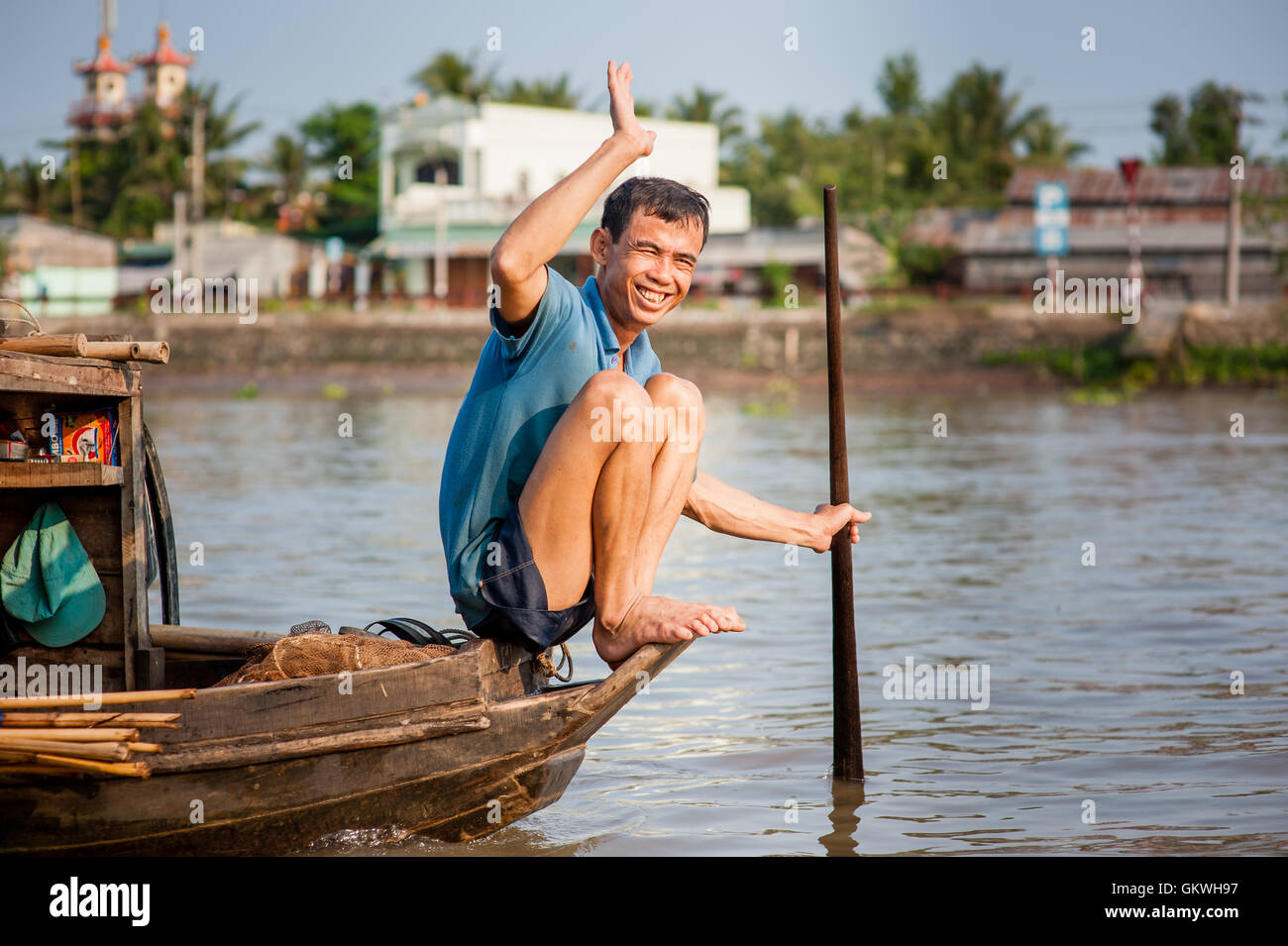 Friendly man waving on boat Stock Photo - Alamy