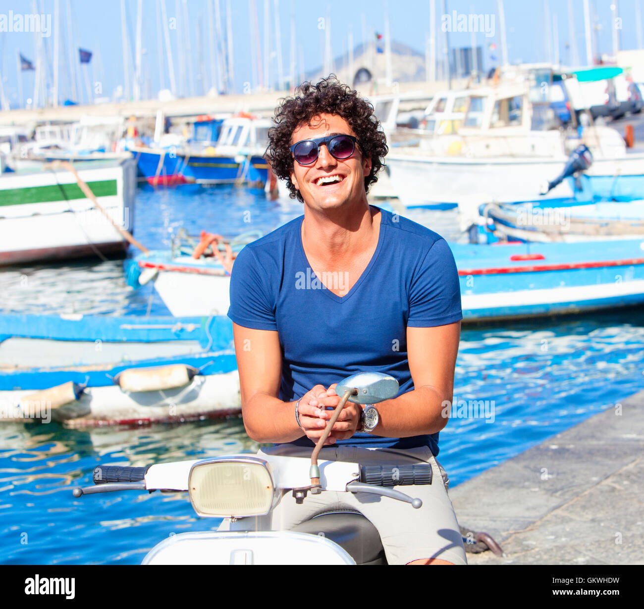 Young Italian Man on Vespa Scooter Smiling Stock Photo - Alamy