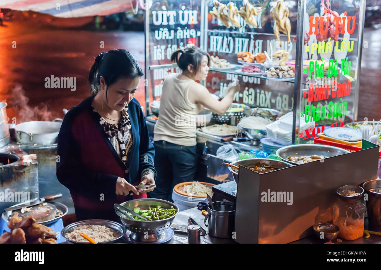 Women cooking at street restaurant Stock Photo - Alamy