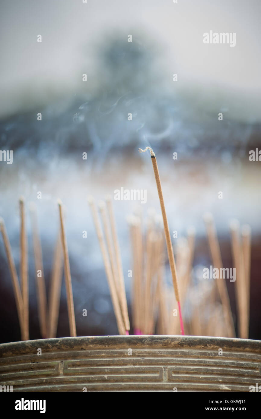 Burning incense at shrine hi-res stock photography and images - Alamy