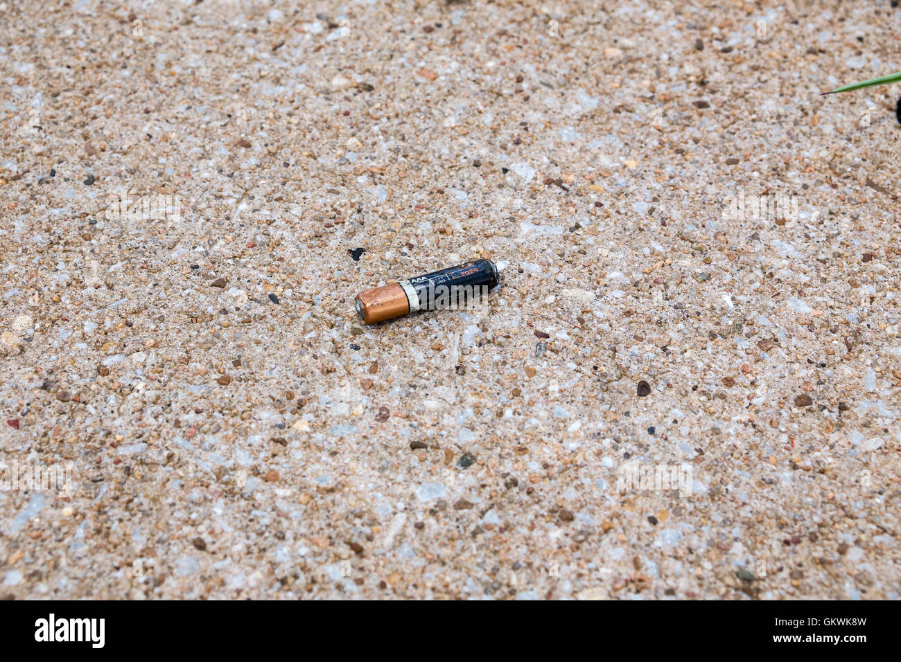 Crushed battery on pavement Stock Photo - Alamy