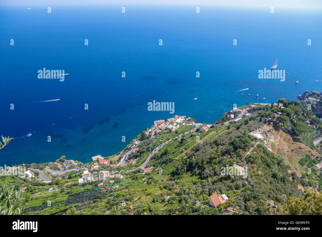 Boats in the ocean by the countryside Stock Photo - Alamy