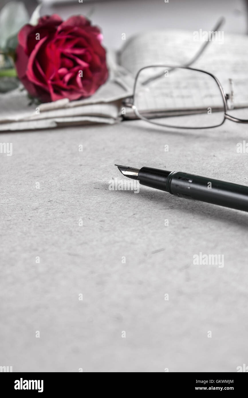 Red Rose on Old Paper Stock Photo - Alamy